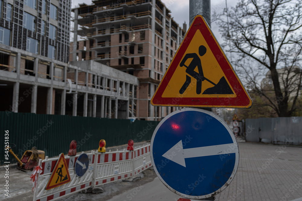 Work in progress. Roadworks, road signs. Men at work. Some signs ...