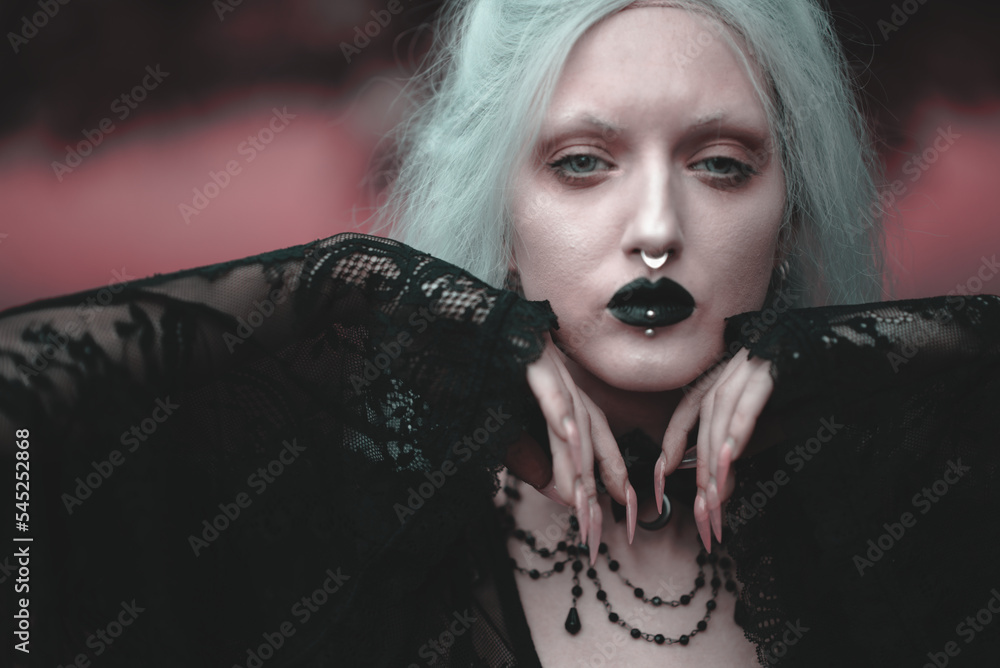 Dark goth girl standing in the forest, portrait of a wiccan witch ...