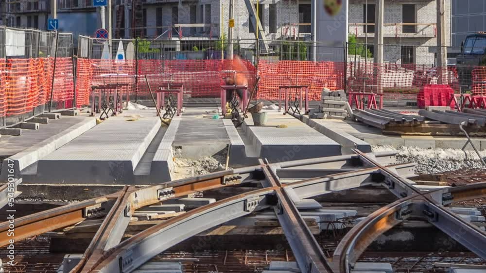Repair works on the street timelapse. Laying of new tram rails on a ...