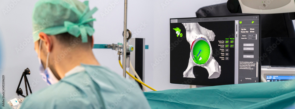 Team of doctor perform total hip, knee arthroplasty replacement surgery ...