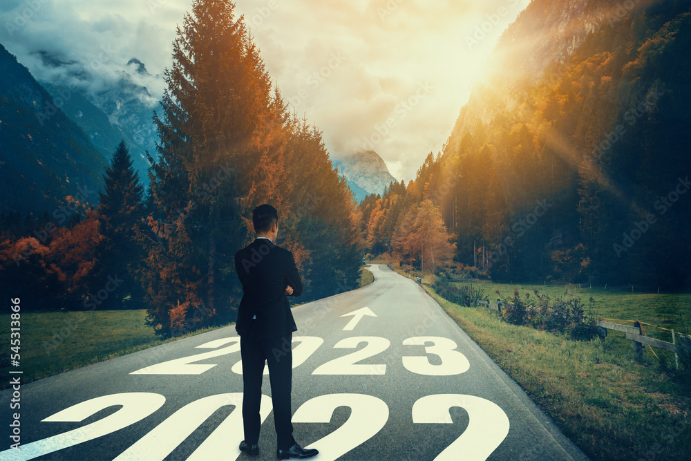 The 2023 New Year journey and future vision concept . Businessman ...