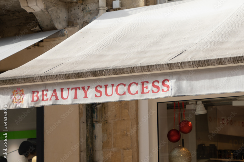 Beauty Success logo letter text on entrance wall store Group shop ...