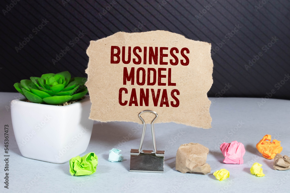 Business Model Canvas. Paper ship and sheet on a gray background. Stock ...