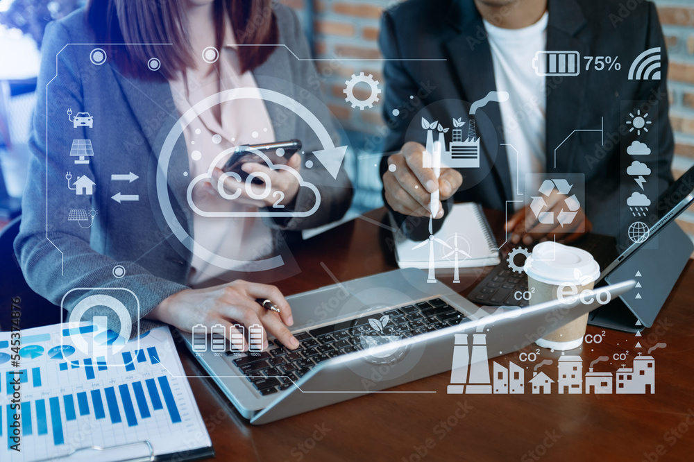 Business team working virtual tablet computer with reduce CO2 concept ...