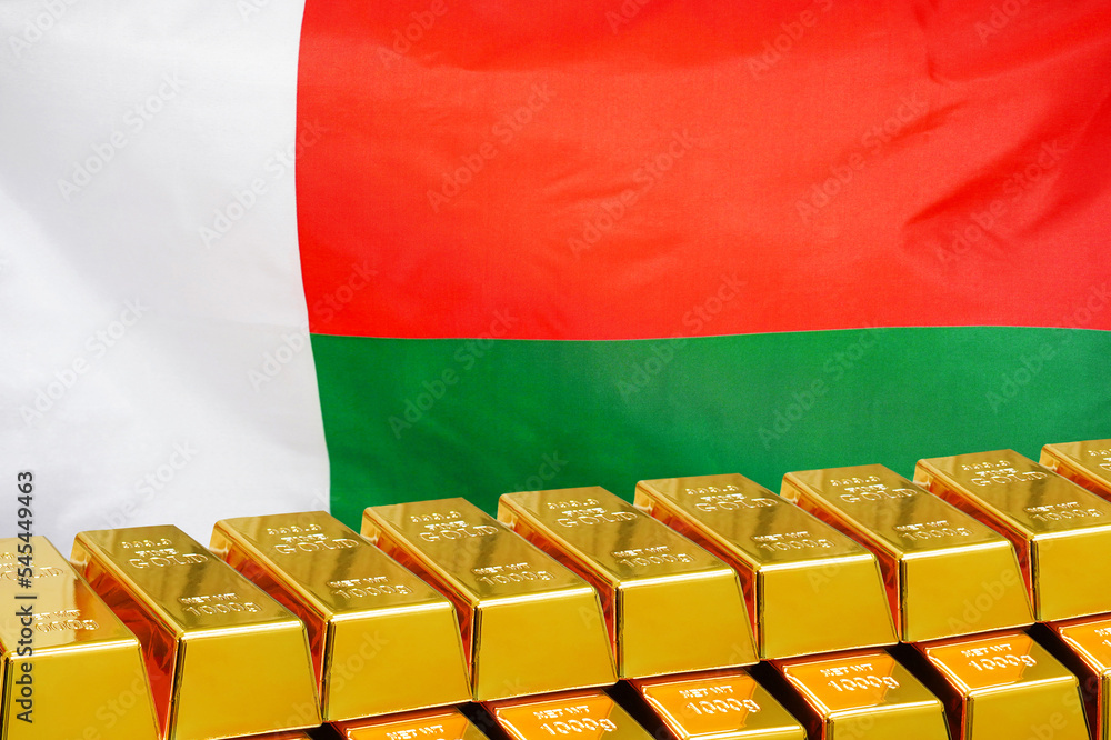 Row of shining golden bullions on the Madagascar flag background ...