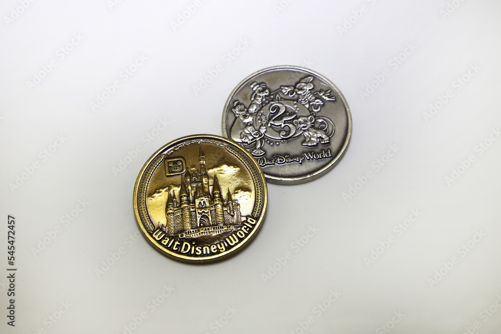 Walt Disney World. Magic Kingdom commemorative coin. Isolated white ...