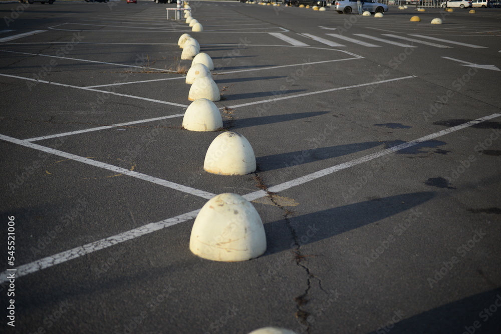 concrete traffic limiters concrete markers painted white, parking space ...