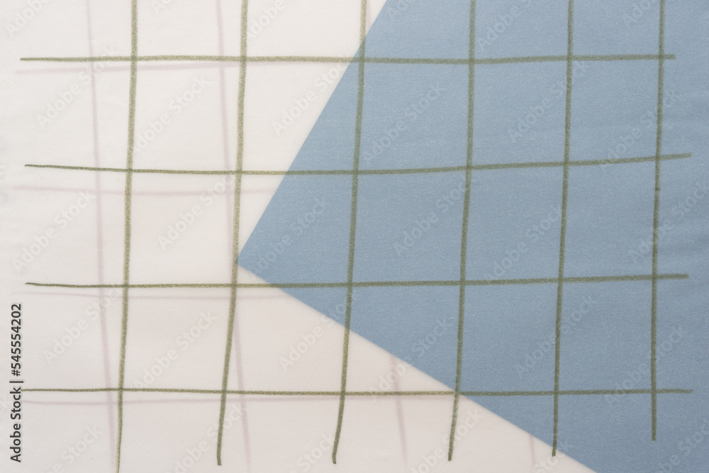 tracing paper with grid pattern and dark shape beneath Stock Photo ...