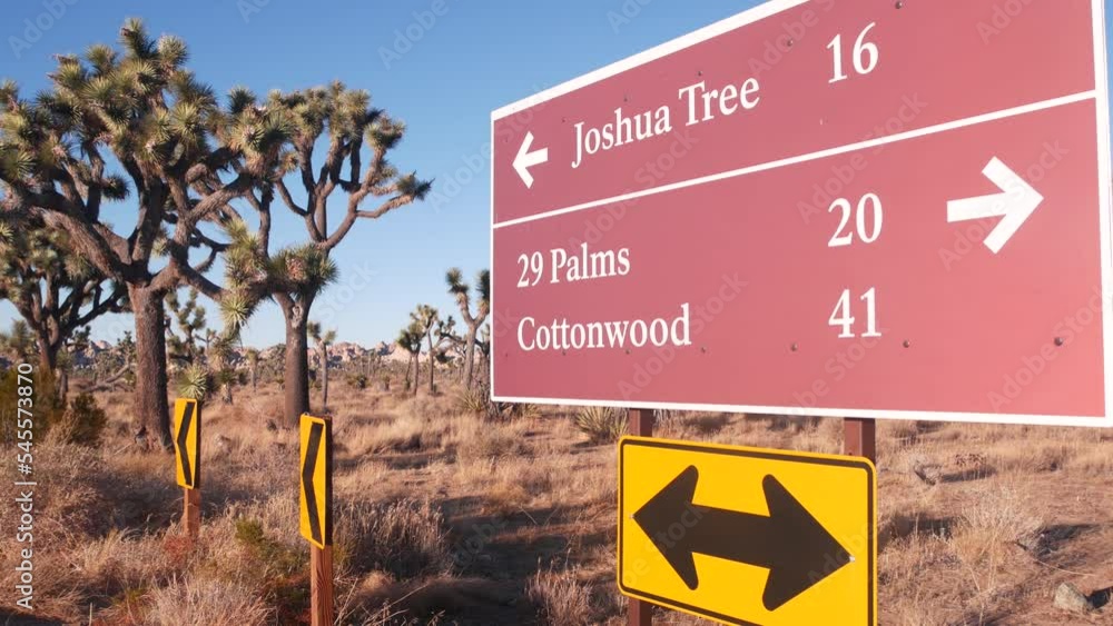 Crossroad sign with direction arrows on road intersection, California ...