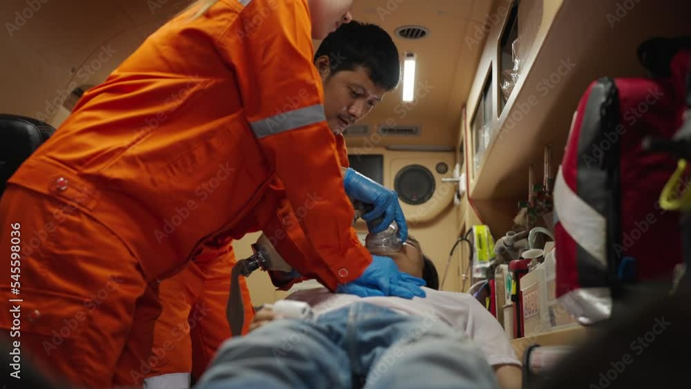 Asian emergency medical technician (EMT) or paramedic team heart ...