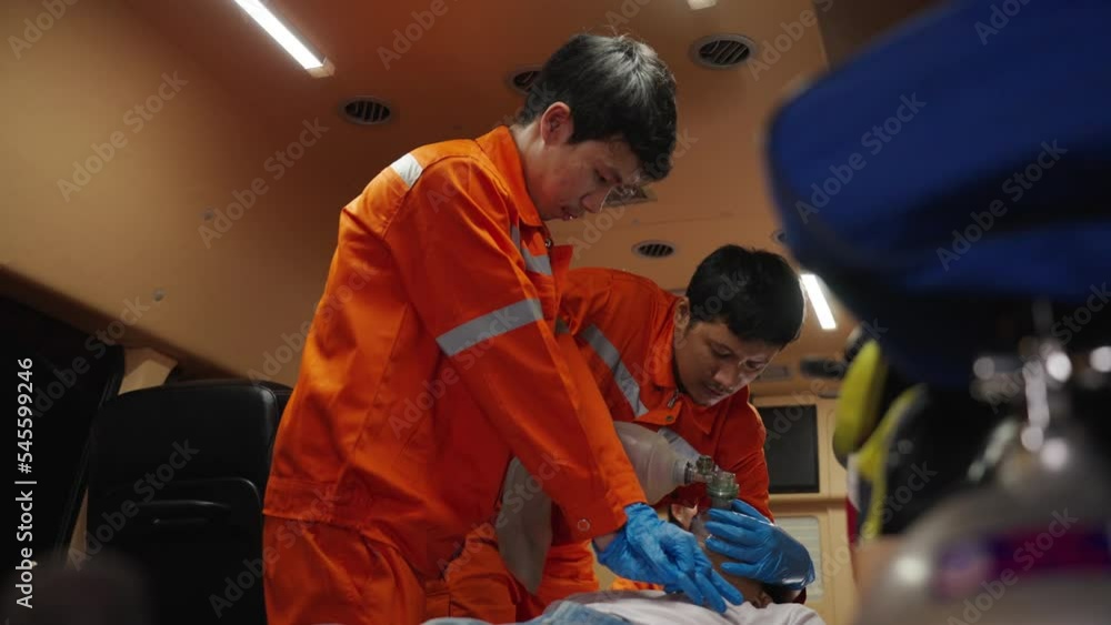 Asian emergency medical technician (EMT) or paramedic team heart ...
