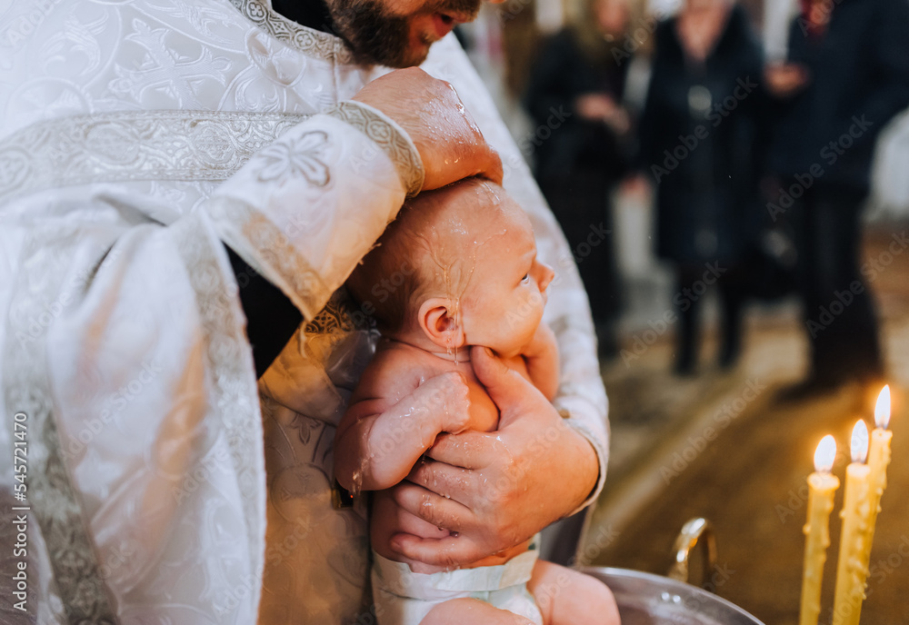 A male Christian priest in a church conducts a sacred rite, a ritual ...