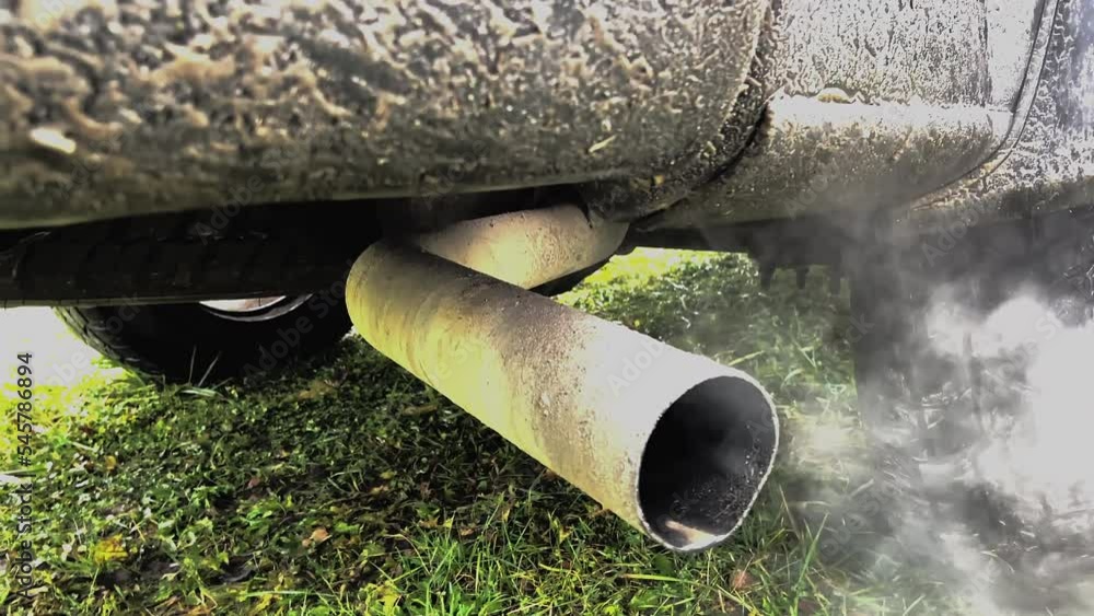 Smoke emissions from Car exhaust pipe, clog air pollution. Toxic fumes ...