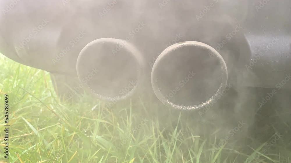 Smoke emissions from Car exhaust pipe, clog air pollution. Toxic fumes ...