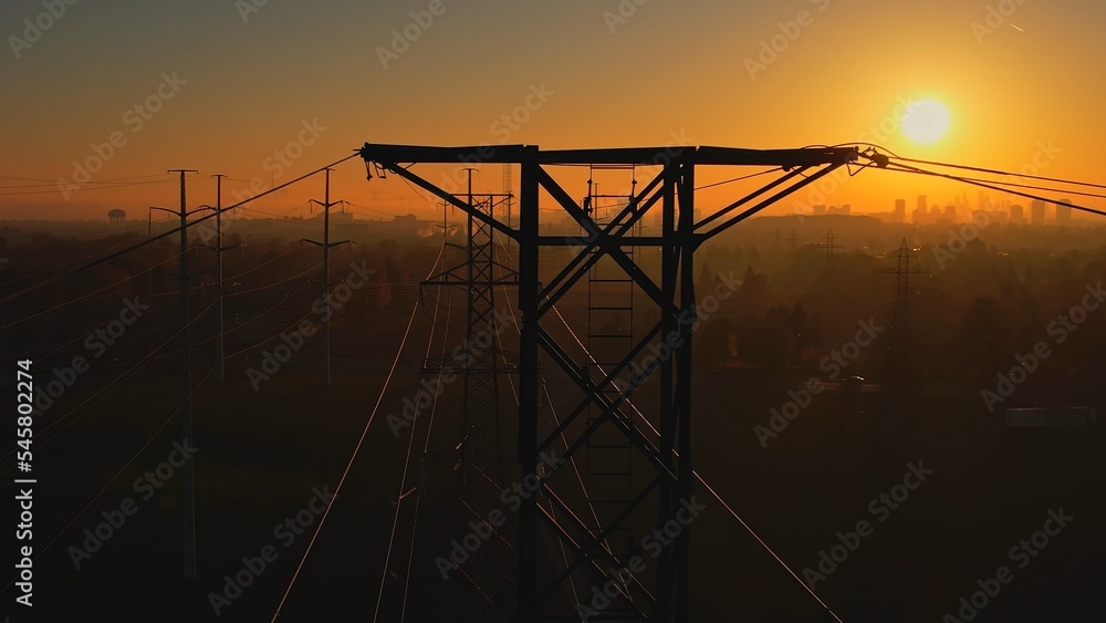 High voltage electricity pylon at golden hour background. International ...
