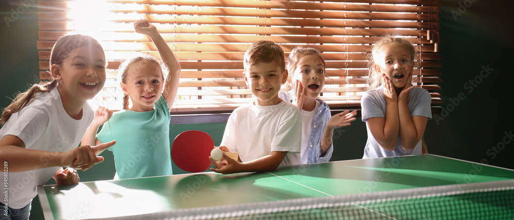 Cute happy children playing ping pong indoors. Banner design Stock ...