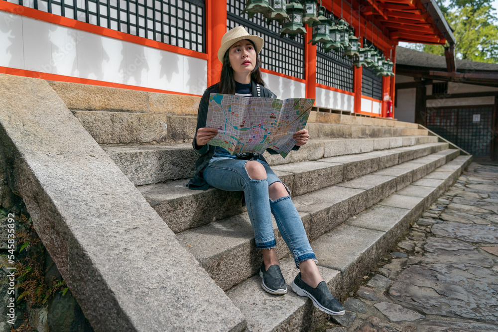 confused asian Japanese female backpacker looking into distance for ...