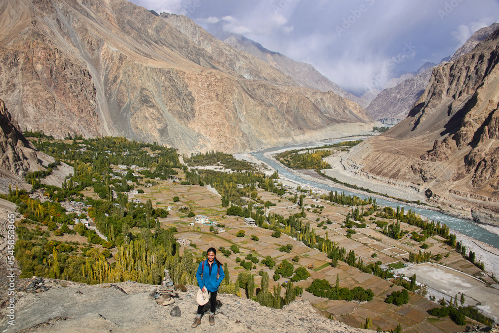 Tourist at the Balti village of Turtuk, once Pakistan, now part of Ladakh, India, viewed in ...