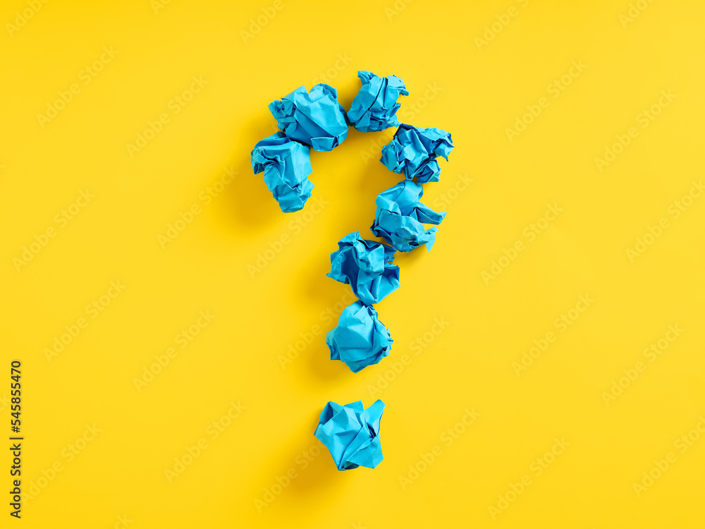 Question mark symbol made out of blue crumpled papers on yellow ...