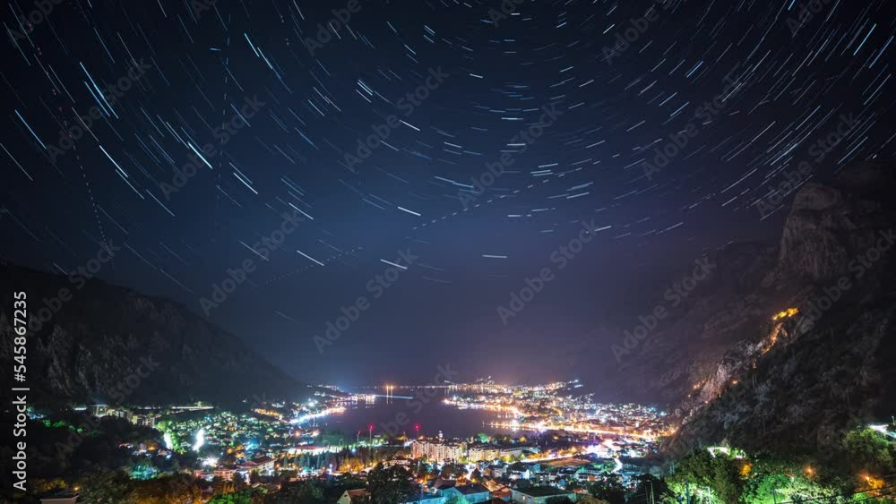 Amazing time lapse of star trails in the night sky above the ...