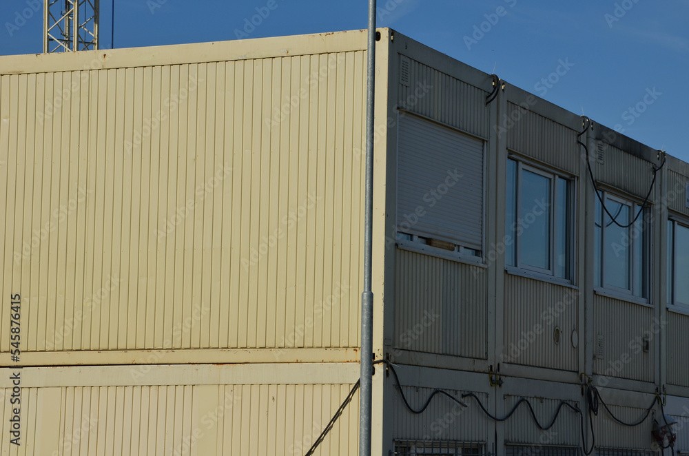 modular housing in stacked container cells. each module has a different ...