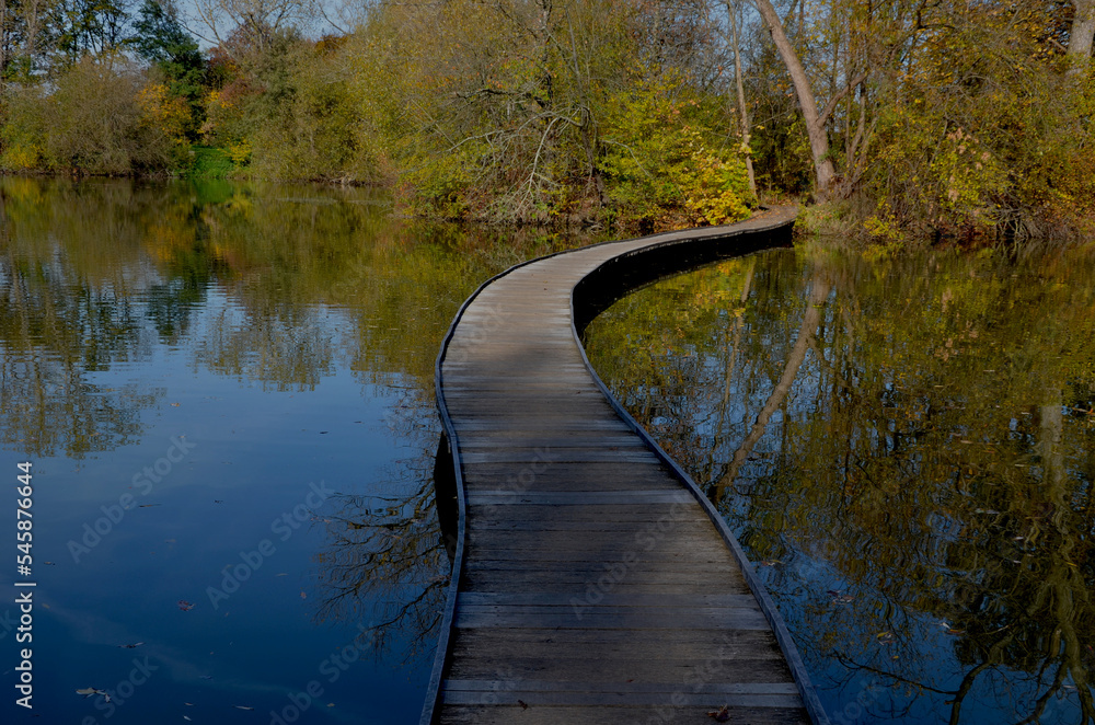 floating walkway made of wooden planks. narrow curved paths on stilts ...