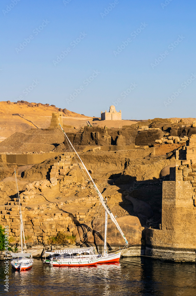 Egypt, Aswan Governorate, Aswan, Sailboats floating on bank of Nile ...