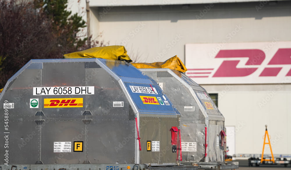 Boxes for loading luggage in airplanes part of DHL cargo transportation ...