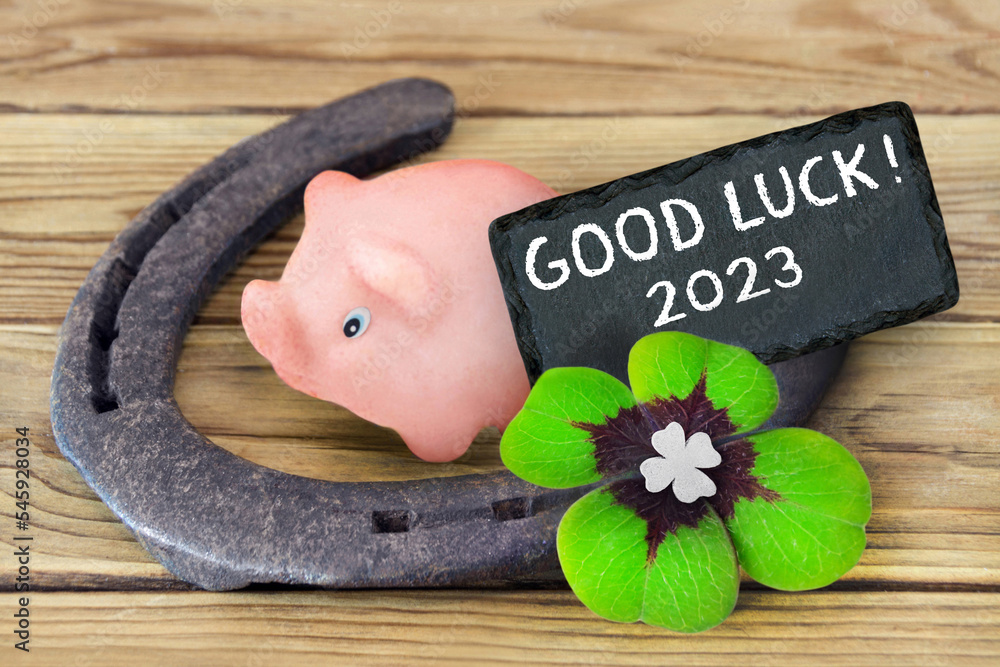 Lucky symbols marzipan piggy and clover with Good Luck 2023 on wooden ...