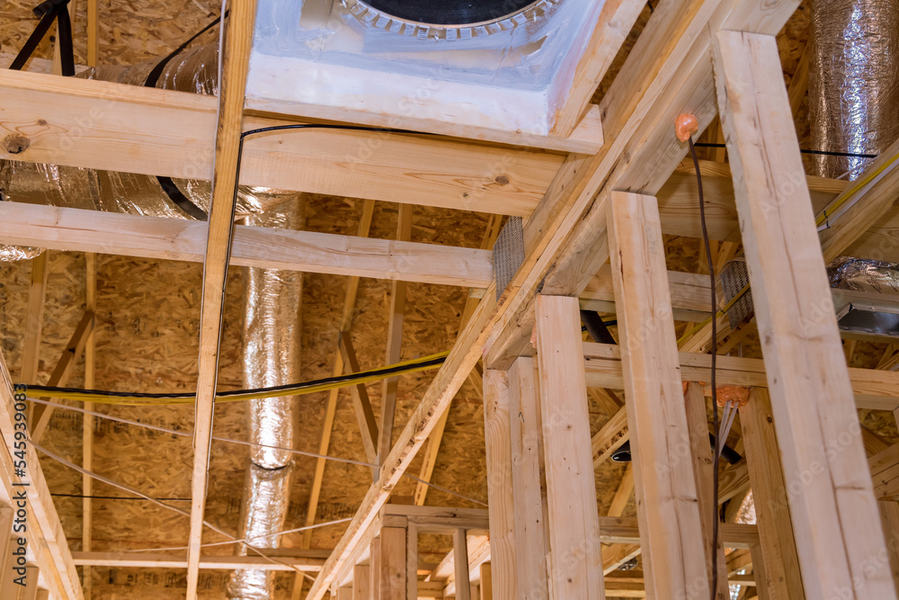 A new building under construction with installation of HVAC tubing ...