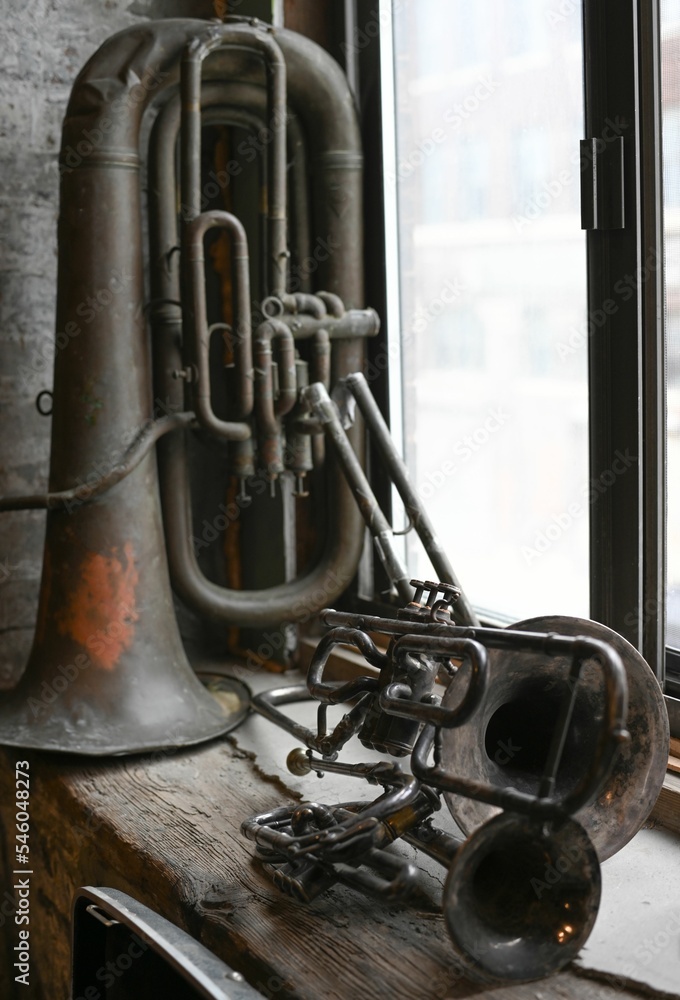 Vintage tarnished antique wind instrument with a beautiful patina as ...