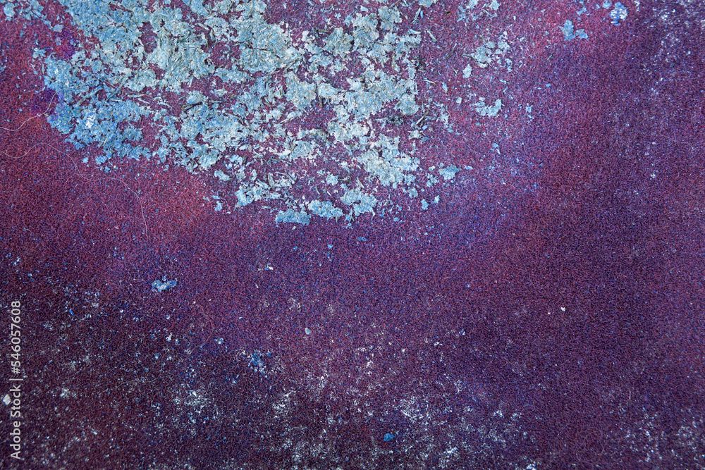 Texture of a burgundy fabric surface strewn with blue crystals, dirty ...