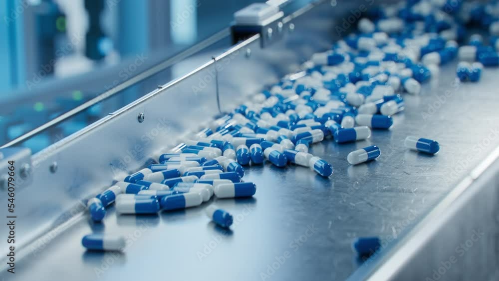 Capsules are Moving on Conveyor at Modern Pharmaceutical Factory ...