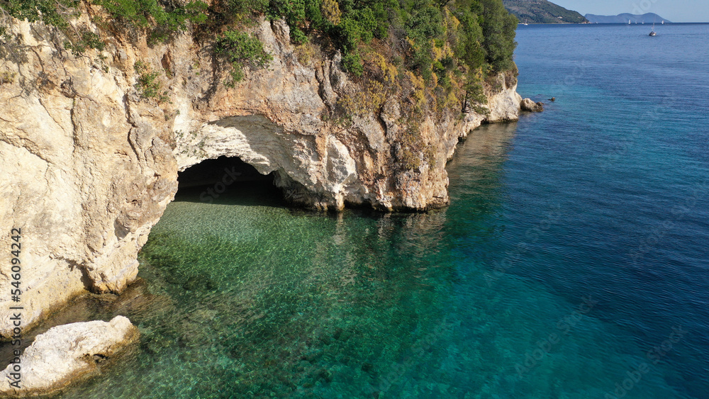 Aerial drone photo of famous small bay and beach with crystal clear sea ...