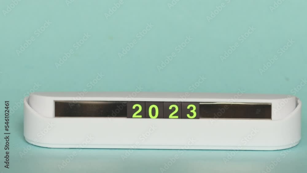 happy 2023 year.small digits numbers in square magnetic shapes instead ...