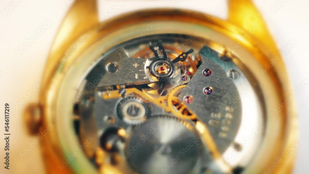 Mechanism of an old mechanical wrist watch chronometer in motion close ...