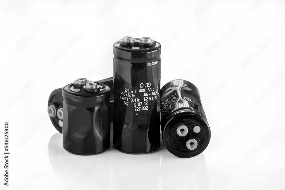 High voltage electrolytic capacitors on white background Stock Photo ...