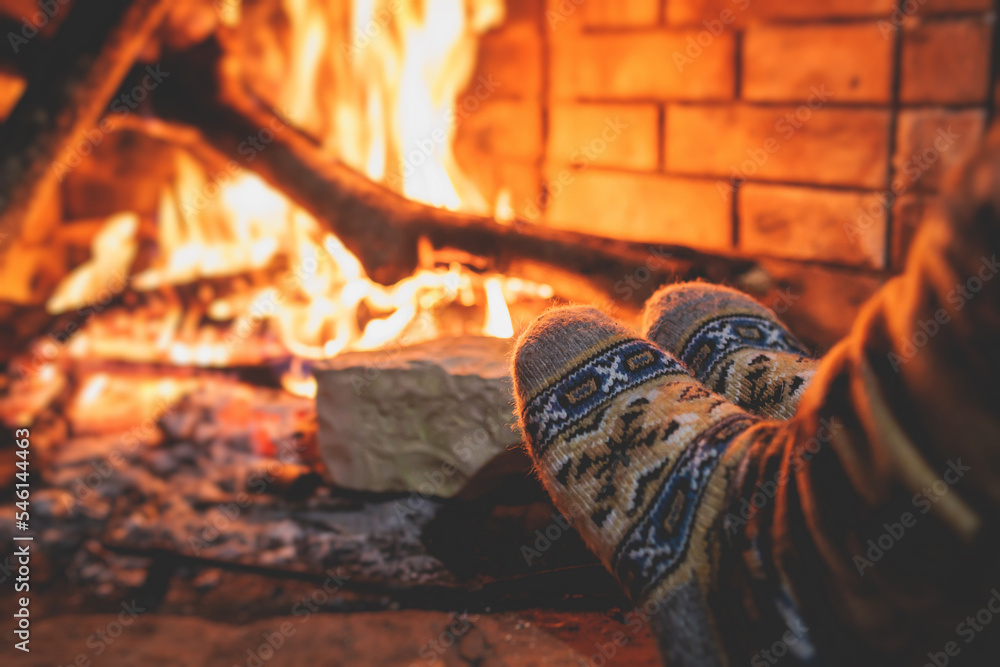 Zdjęcie Stock: Warming up the fire, cozy winter night in the cabin ...