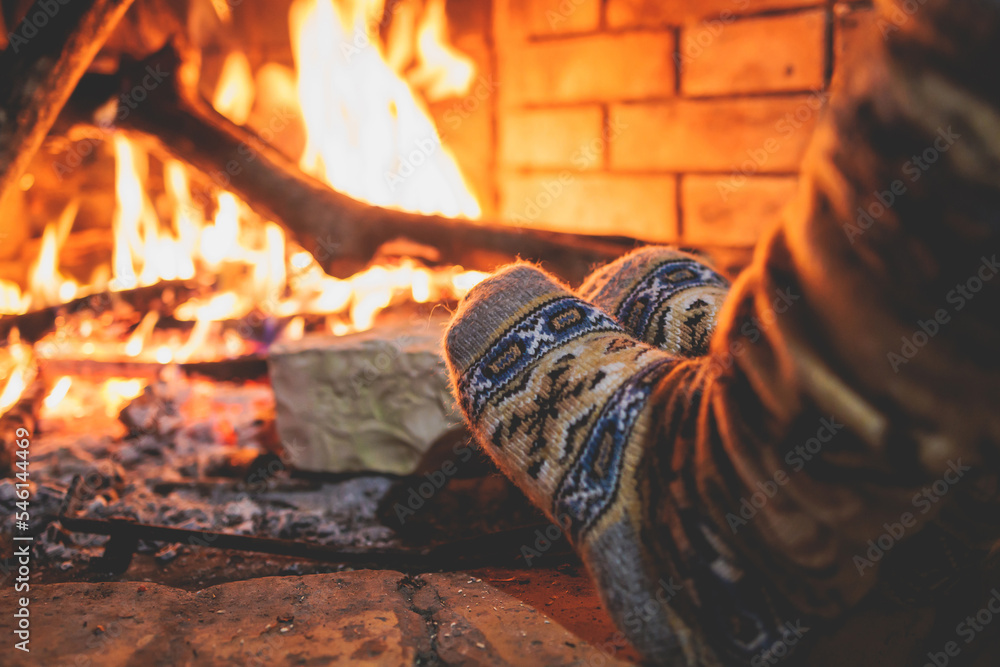Warming up the fire, cozy winter night in the cabin house by the ...