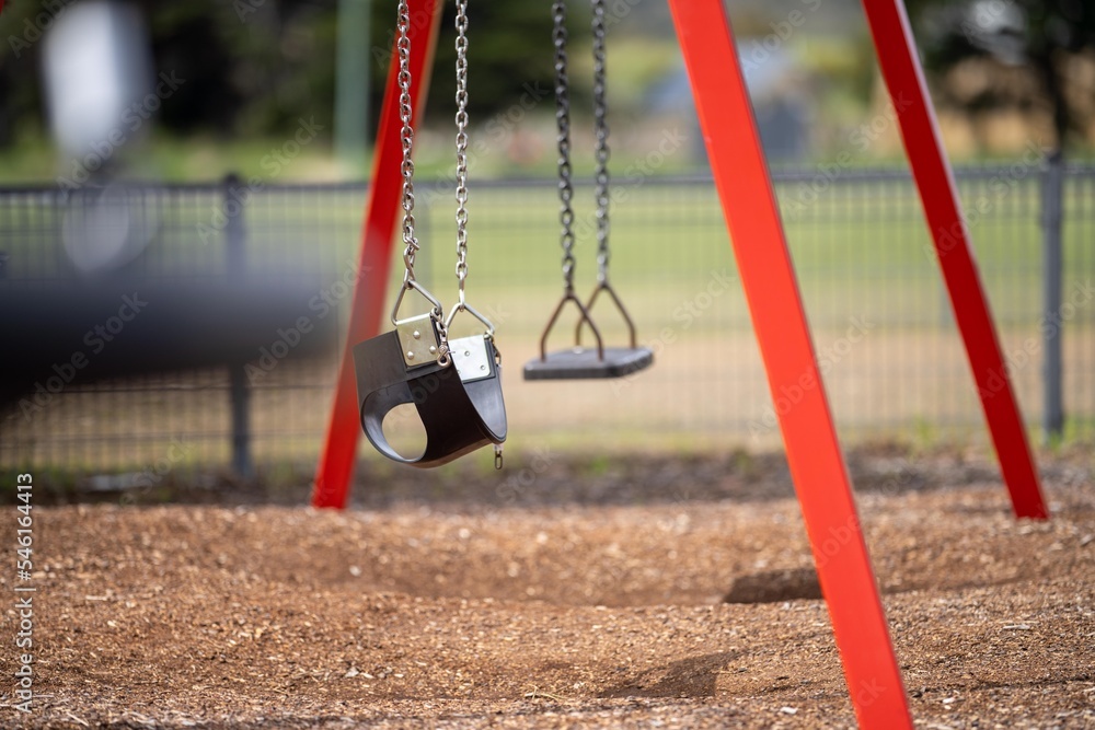 slides and swings in a playground in a park in australia ภาพถ่ายสต็อก ...