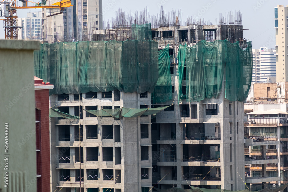 Safety nets and scaffolding on a tall high rise building under ...