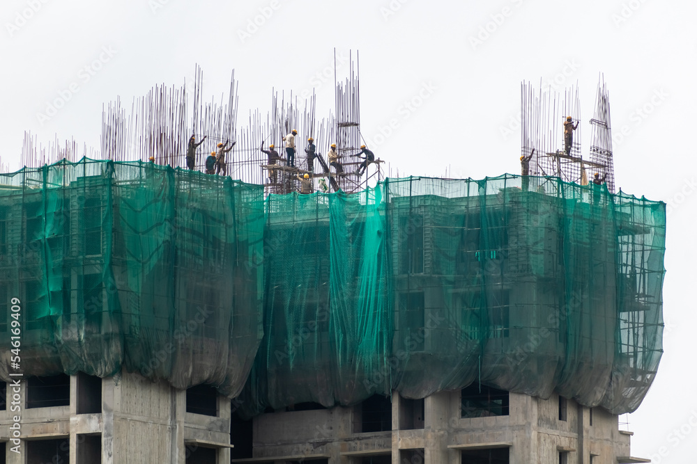 Safety nets and scaffolding on a tall high rise building under ...