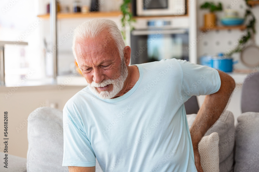 Senior elderly man touching his back, suffering from backpain, sciatica ...