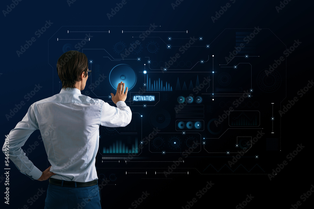 Virtual reality concept with man back view pushing button on digital ...