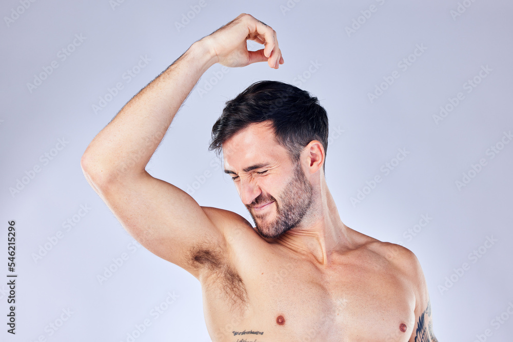 Armpit, stink and hygiene with a man model smelling his underarm in ...