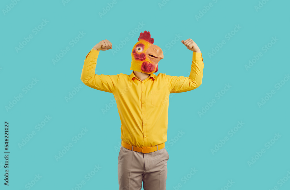 Man in funny chicken disguise pretends to be strong and have superpower ...