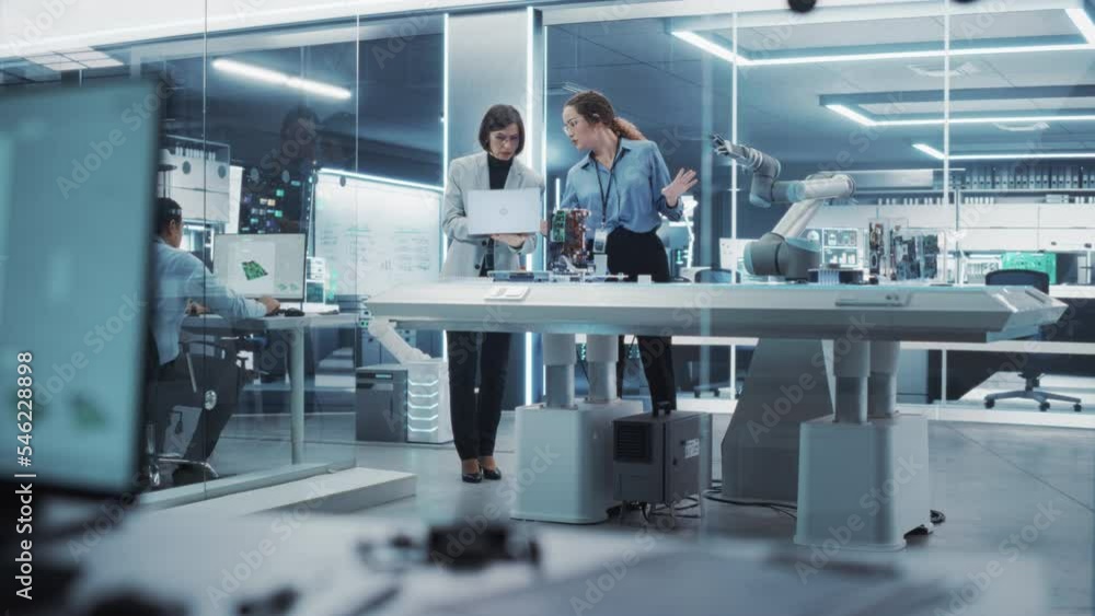 Young Female Engineer Works with Colleague Robotics Scientist with ...
