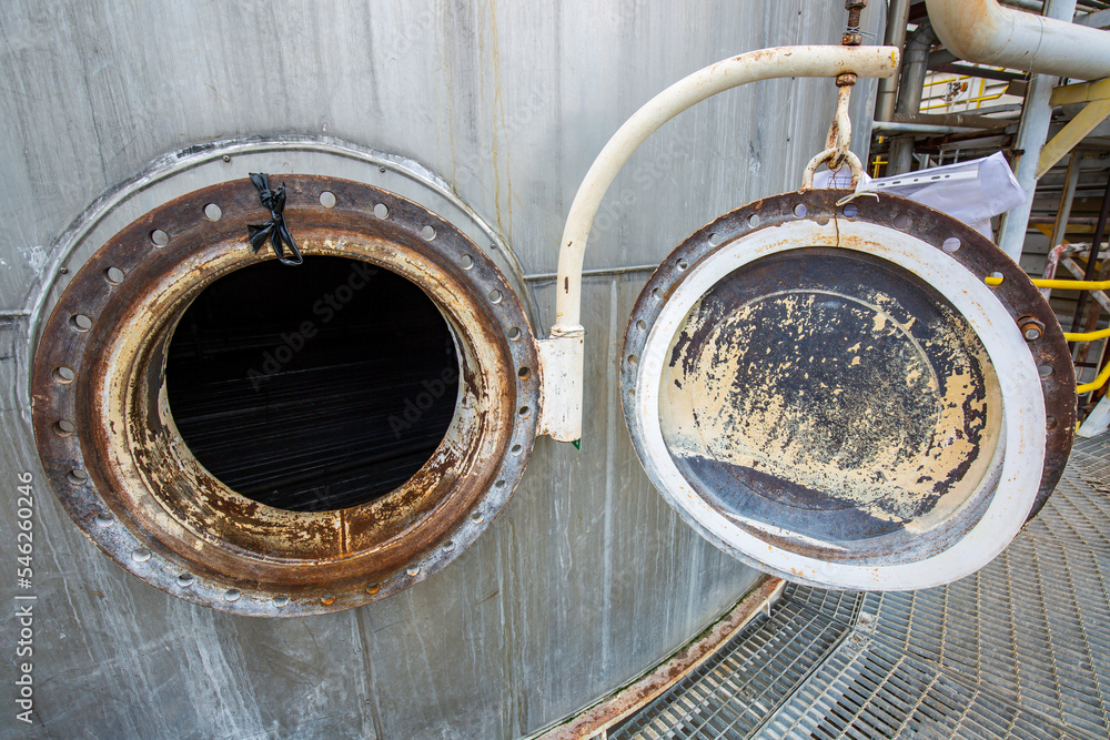 Opened rusty manhole on shell plate storage tank confined space Stock ...