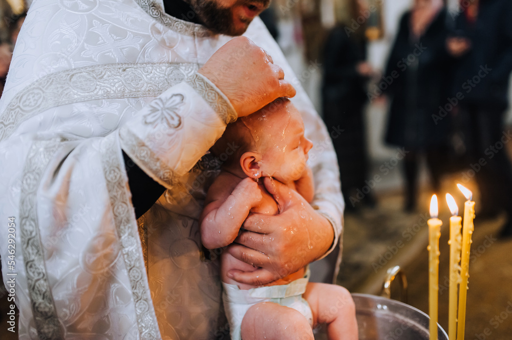 A male Christian priest in a church conducts a sacred rite, a ritual ...