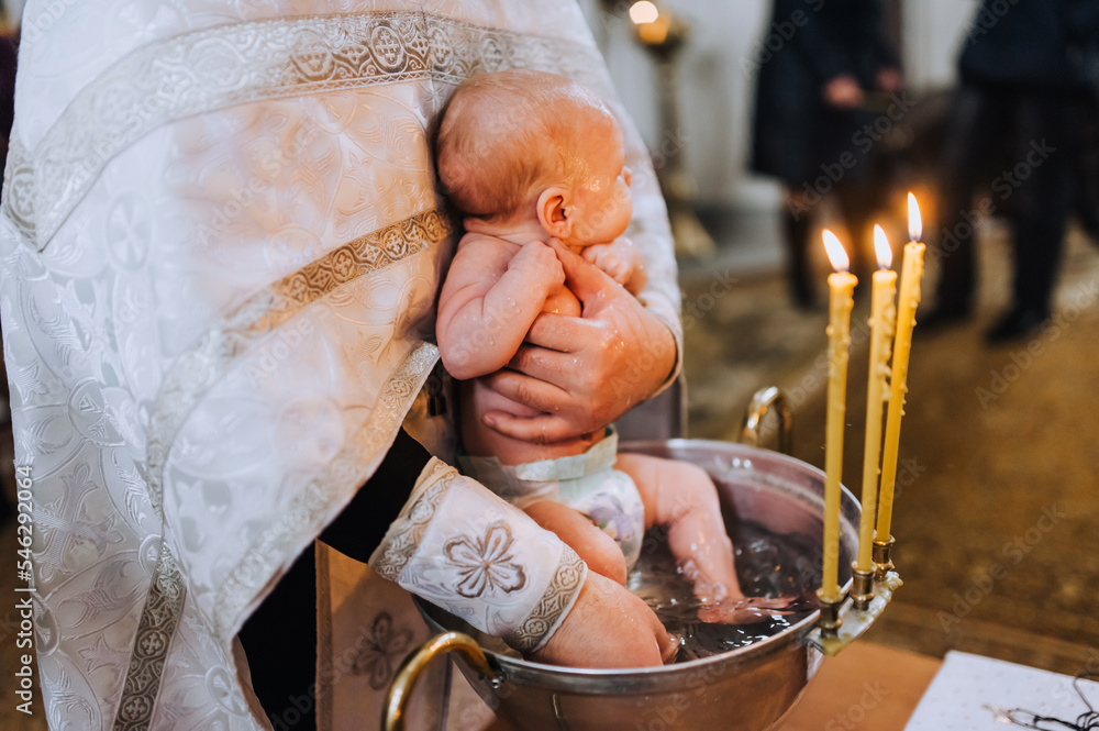A male Christian priest in a church conducts a sacred rite, a ritual ...